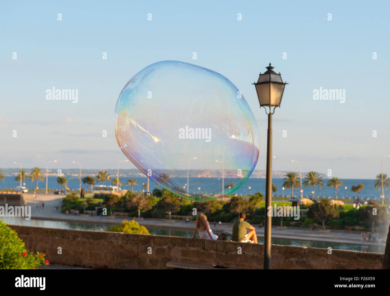 The man made giant soap bubble in Palma de Mallorca, Spain Stock Photo ...