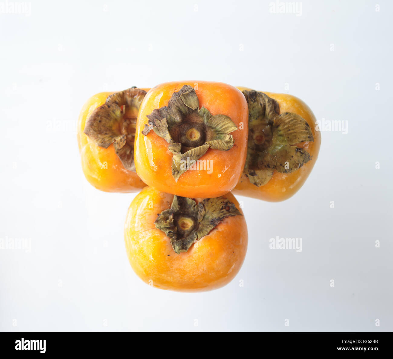 Persimmon on a white background Stock Photo - Alamy
