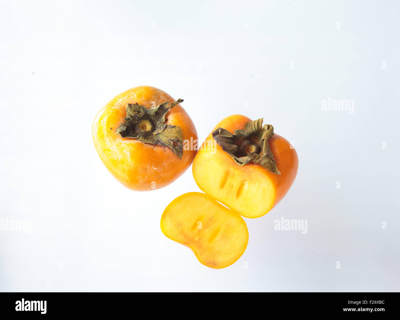Persimmon on a white background Stock Photo - Alamy
