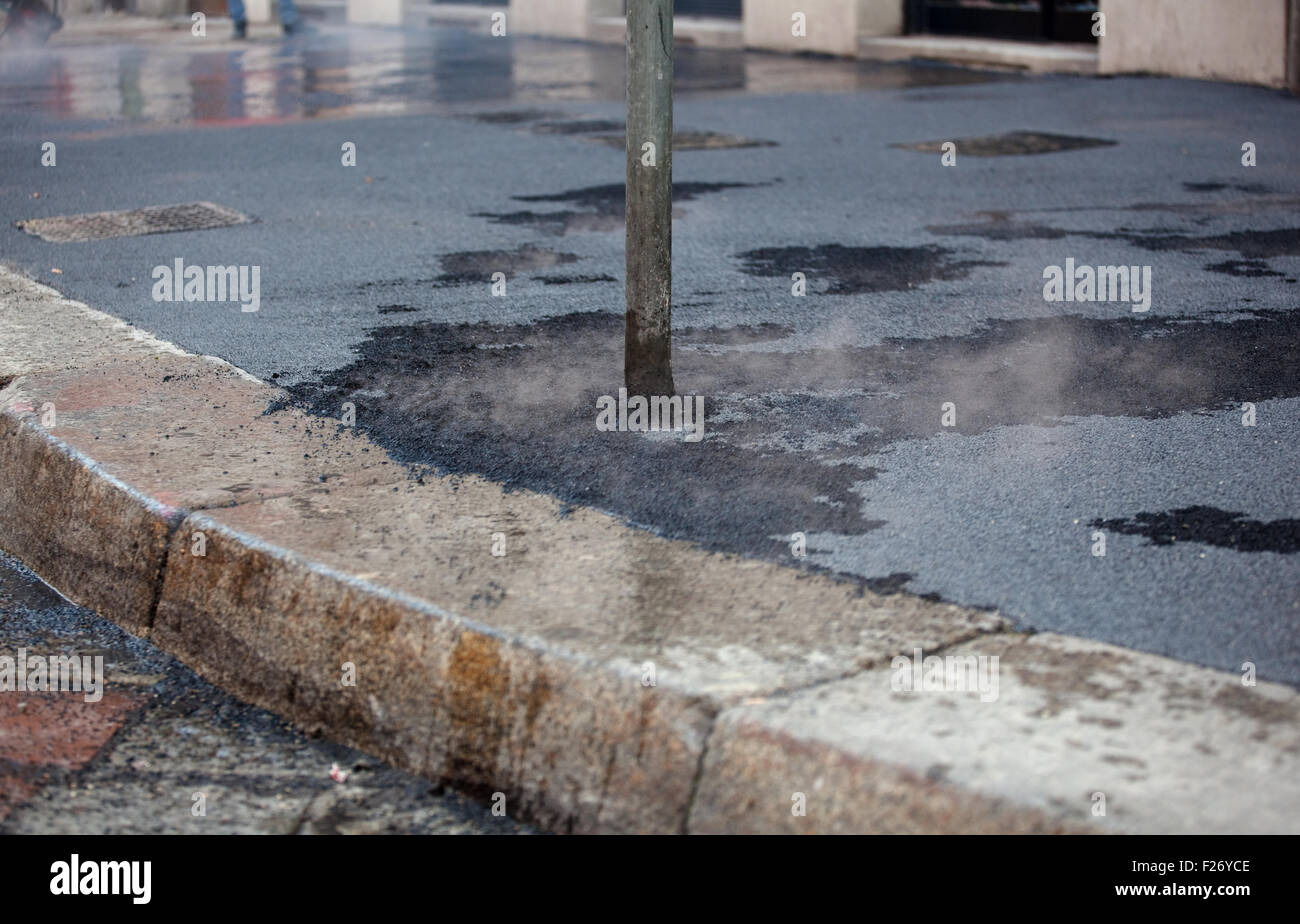 Photo of new Asphalt smoking Stock Photo - Alamy