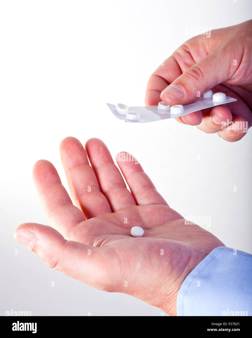Hand giving pills isolated on white background Stock Photo - Alamy