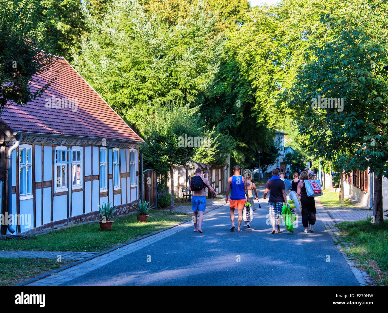 Tourists walking Großer Stechlinsee, Lake Stechlin resort, Brandenburg ...