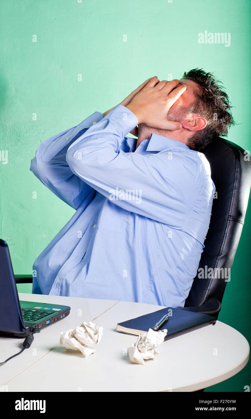 Frustrated and desperate businessman in his office Stock Photo - Alamy