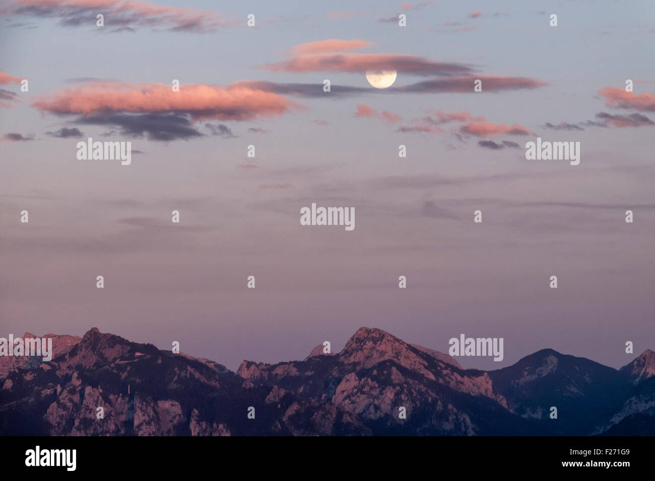 Scenic landscape View of purple coloured mountains with full moon of ...