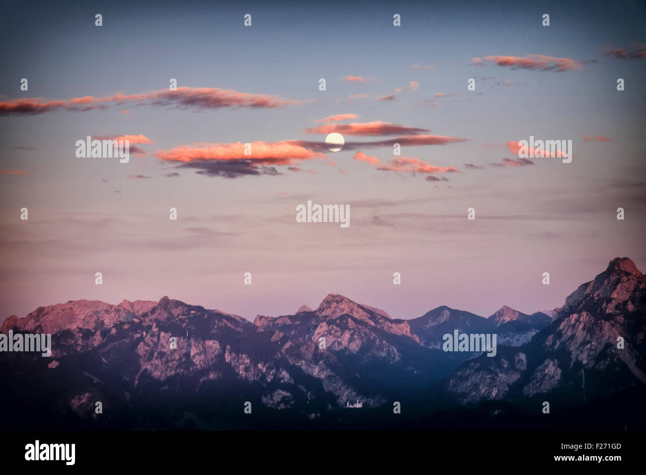 Scenic landscape View of purple coloured mountains with full moon of ...