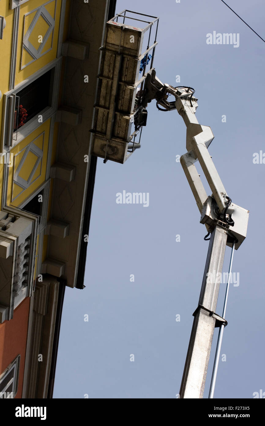 Crane working in a building Stock Photo - Alamy