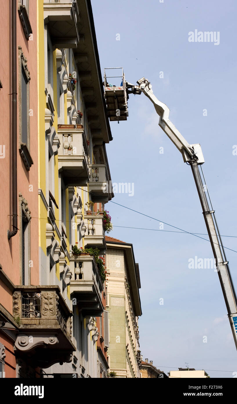Crane working in a building Stock Photo - Alamy