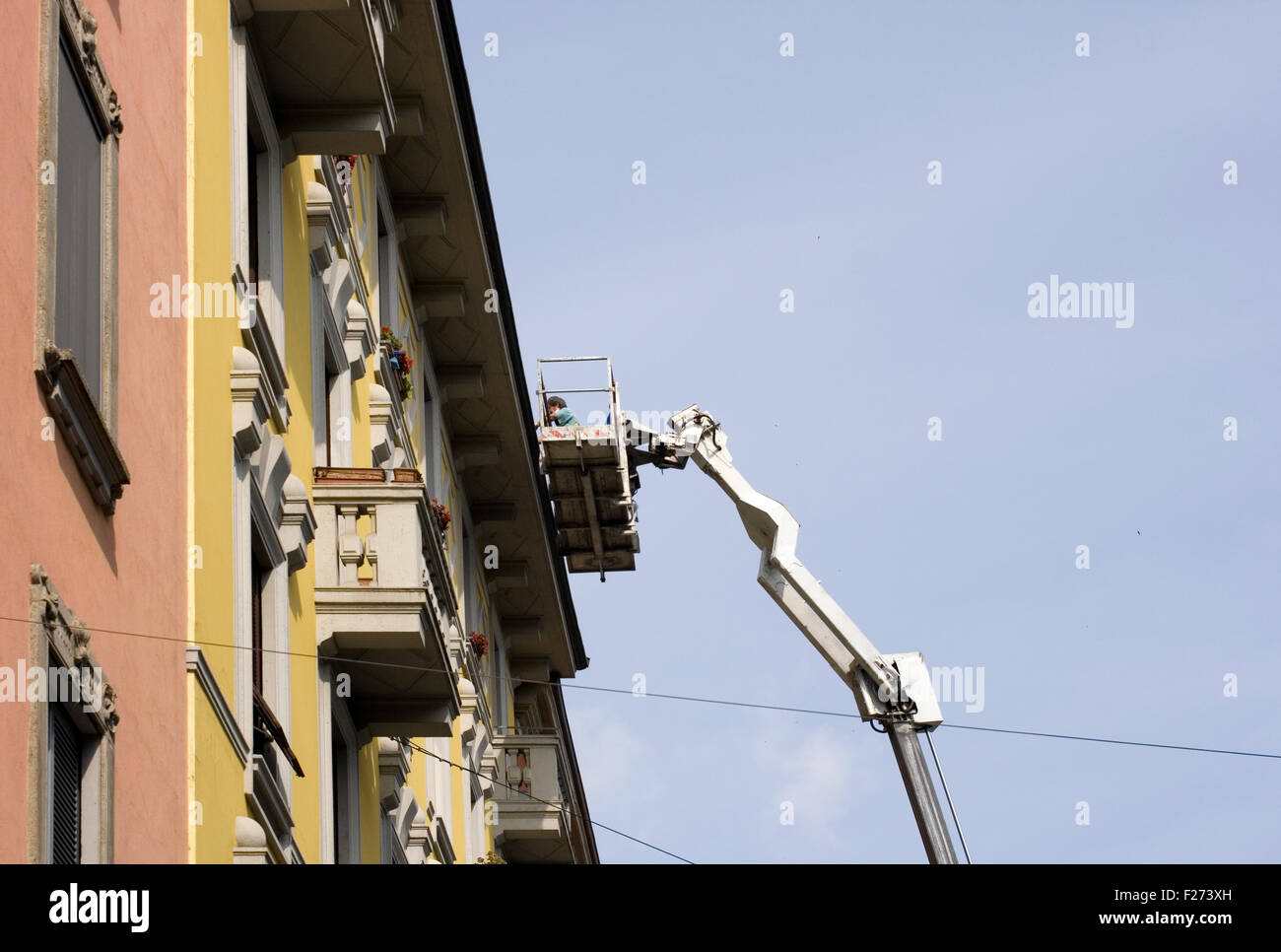 Crane working in a building Stock Photo - Alamy