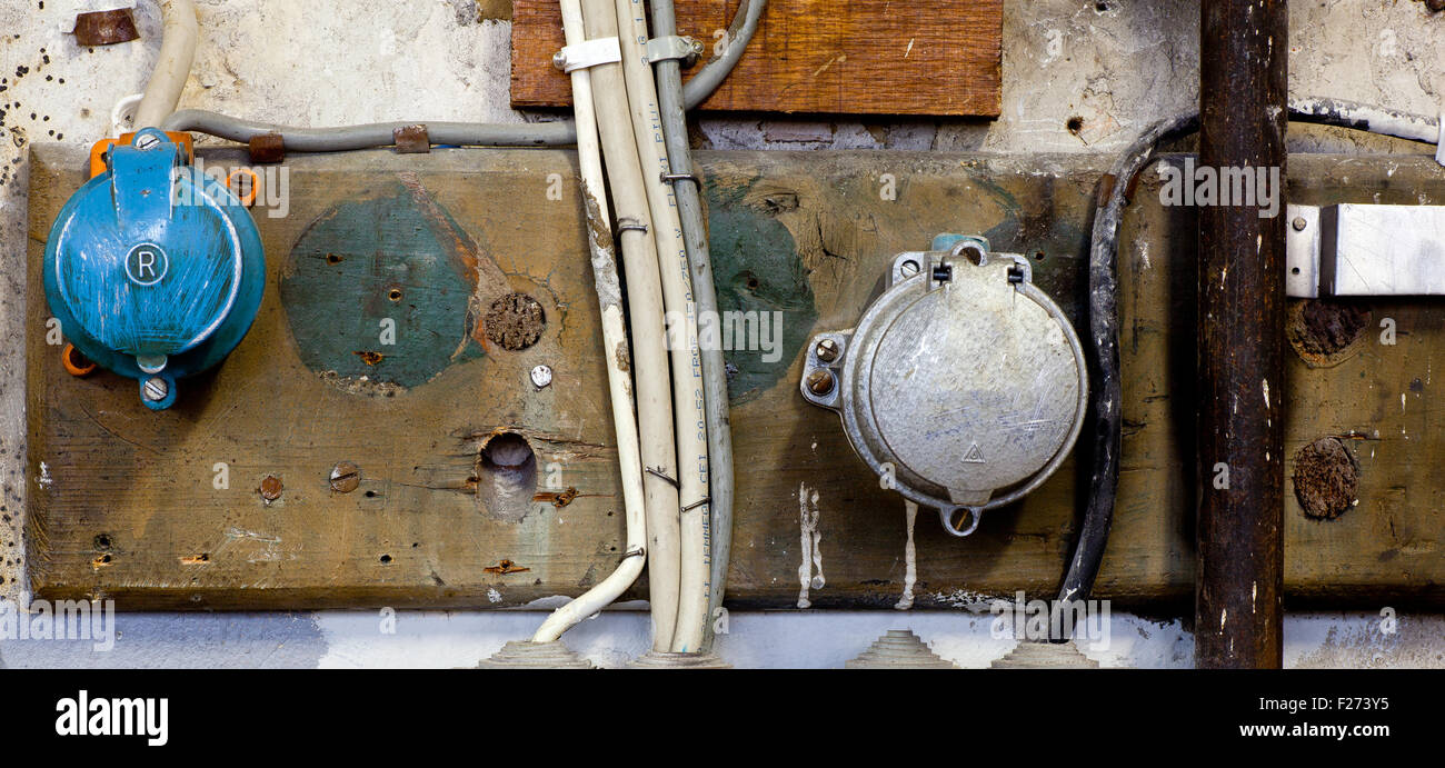 Old and worn electricity sockets Stock Photo - Alamy
