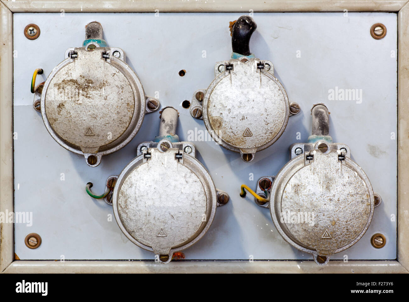 Old and worn electricity sockets Stock Photo - Alamy