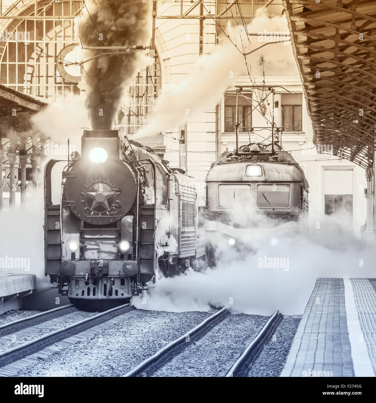 Retro steam train departs from the station Stock Photo - Alamy