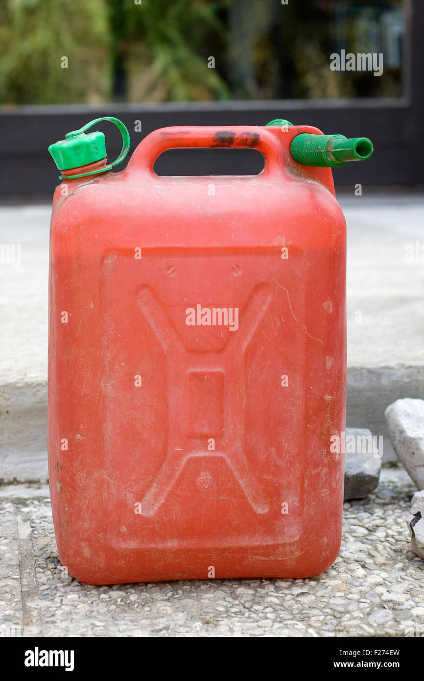 Red petrol can on the street Stock Photo - Alamy