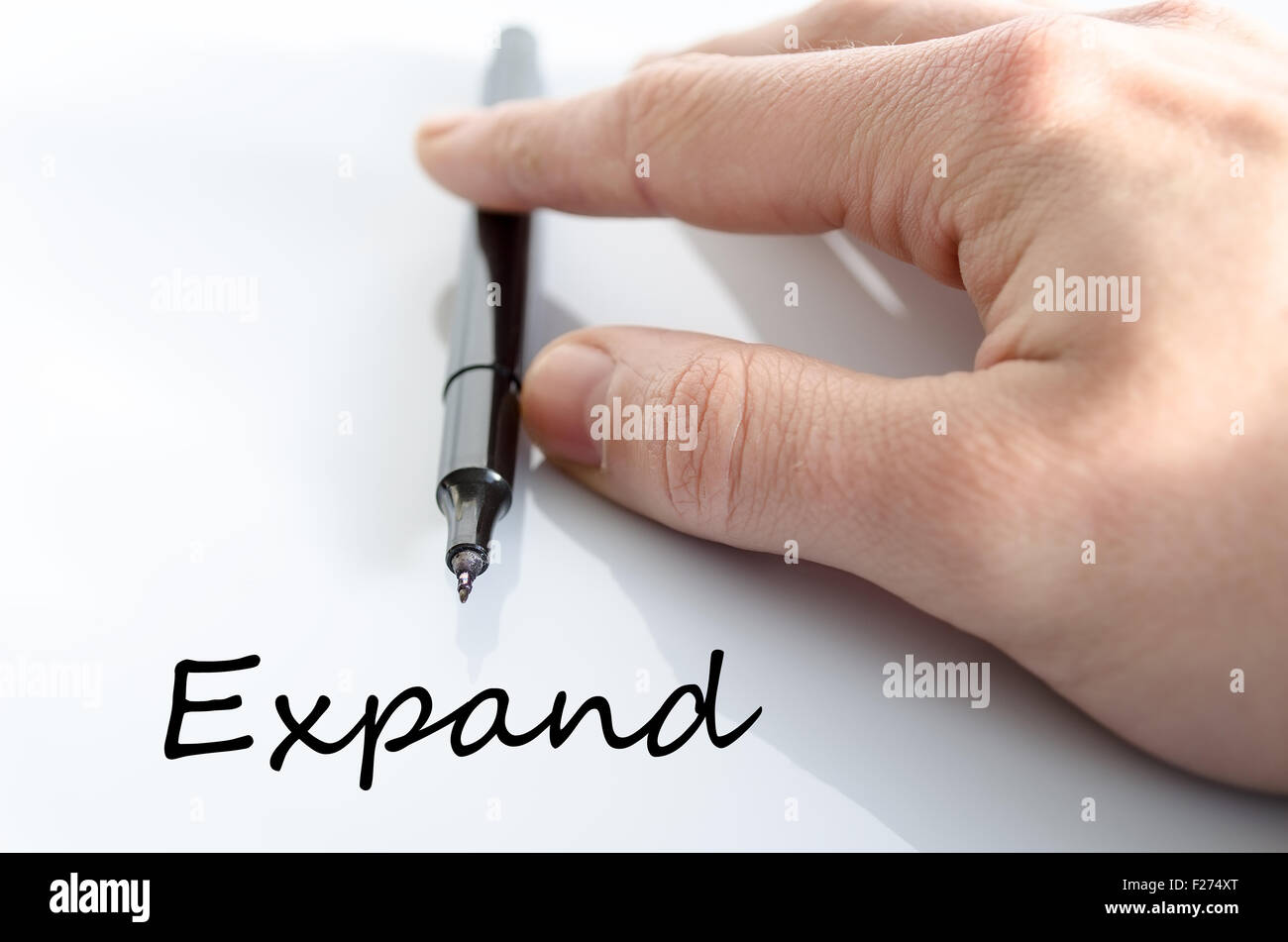 Expand text concept isolated over white background Stock Photo - Alamy