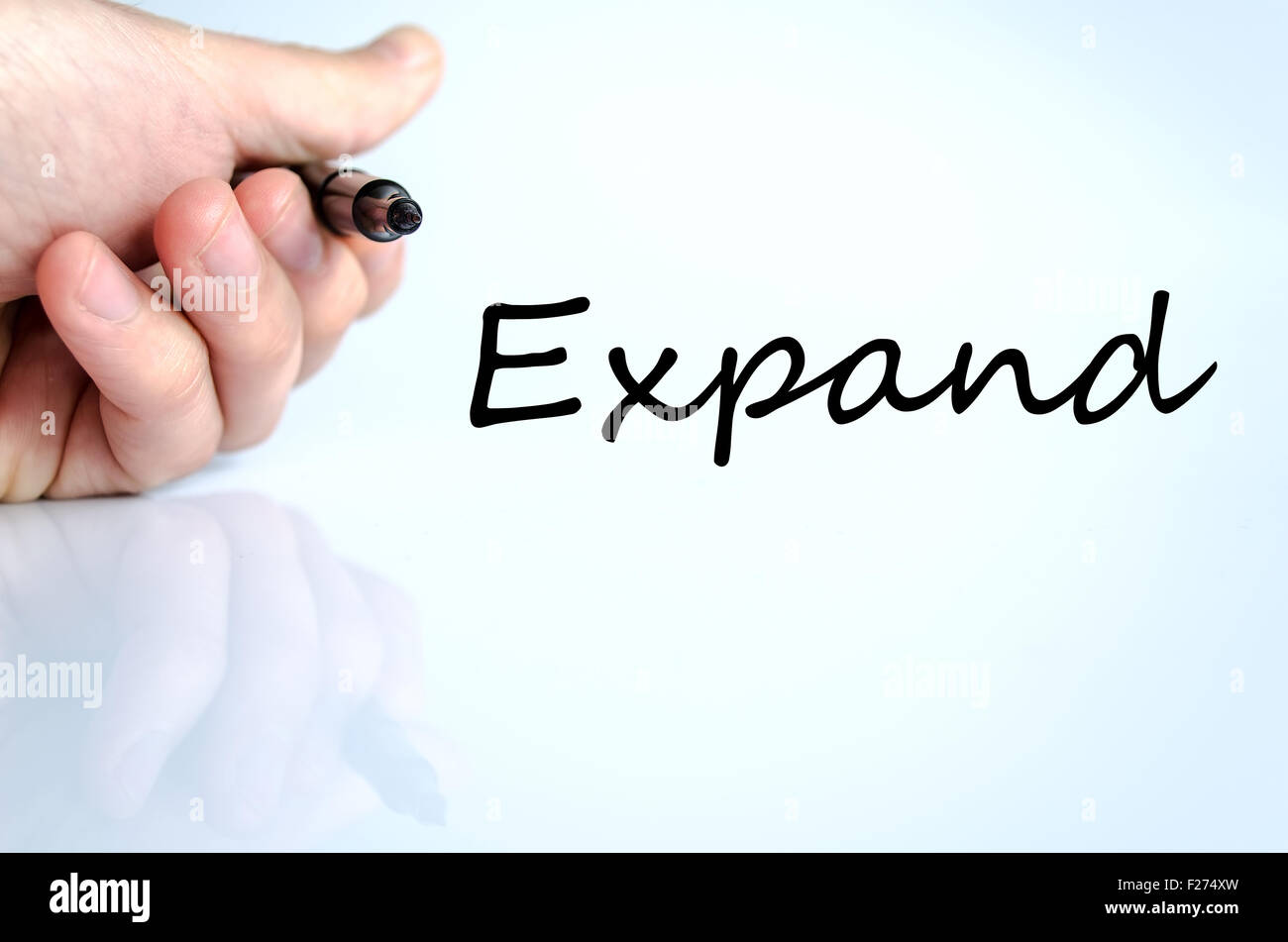 Expand text concept isolated over white background Stock Photo - Alamy