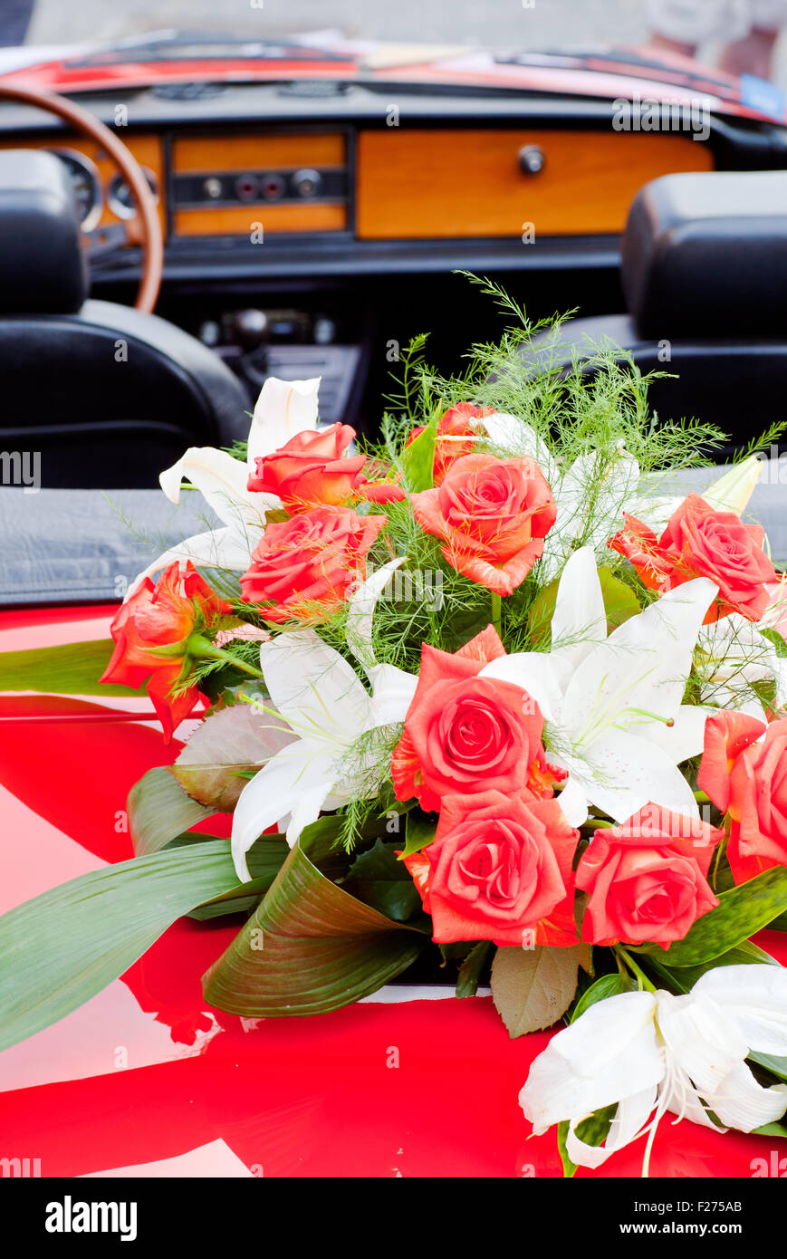 Flower's bouquet on a vintage red car Stock Photo - Alamy