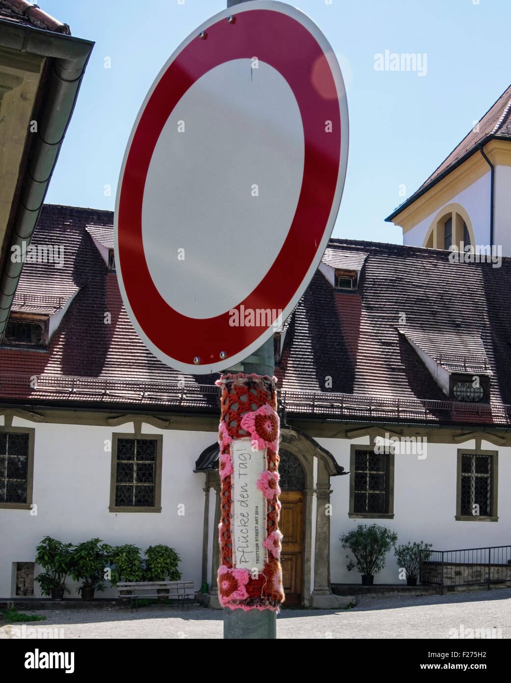 Wool bomber, woolly covering of traffic sign with crochet flowers ...