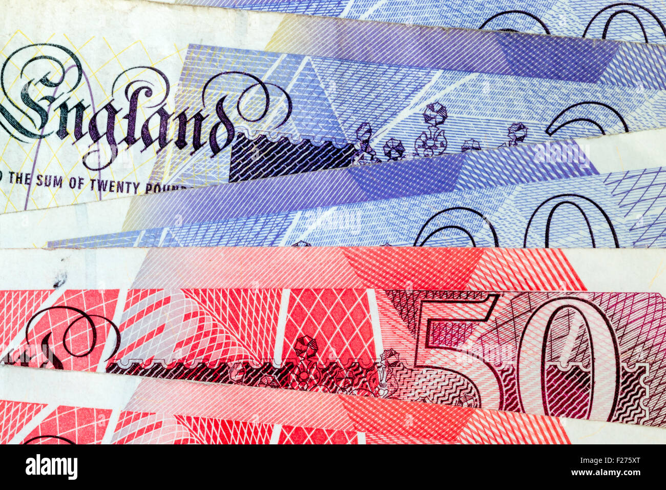 Macro studio shot of English Twenty and Fifty pound notes arranged in a ...
