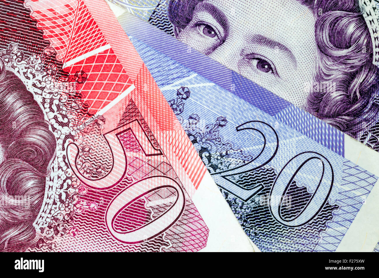 Macro studio shot of English Twenty and Fifty pound notes arranged in a ...