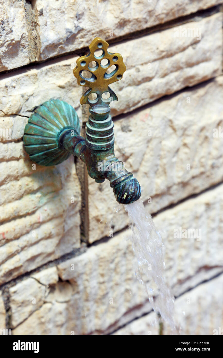 drinking water flows from the faucet on the wall Stock Photo - Alamy