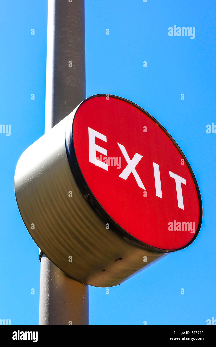 Round barrel shaped Exit sign in red and white Stock Photo - Alamy