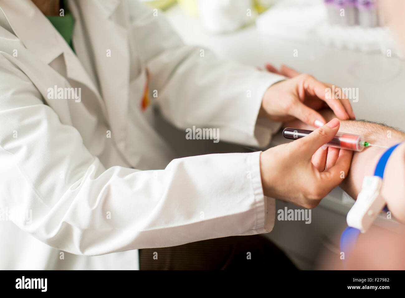 Taking blood in laboratory Stock Photo - Alamy