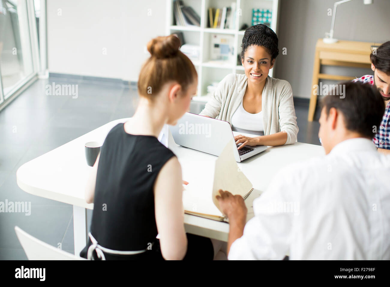 Young people in the office Stock Photo - Alamy