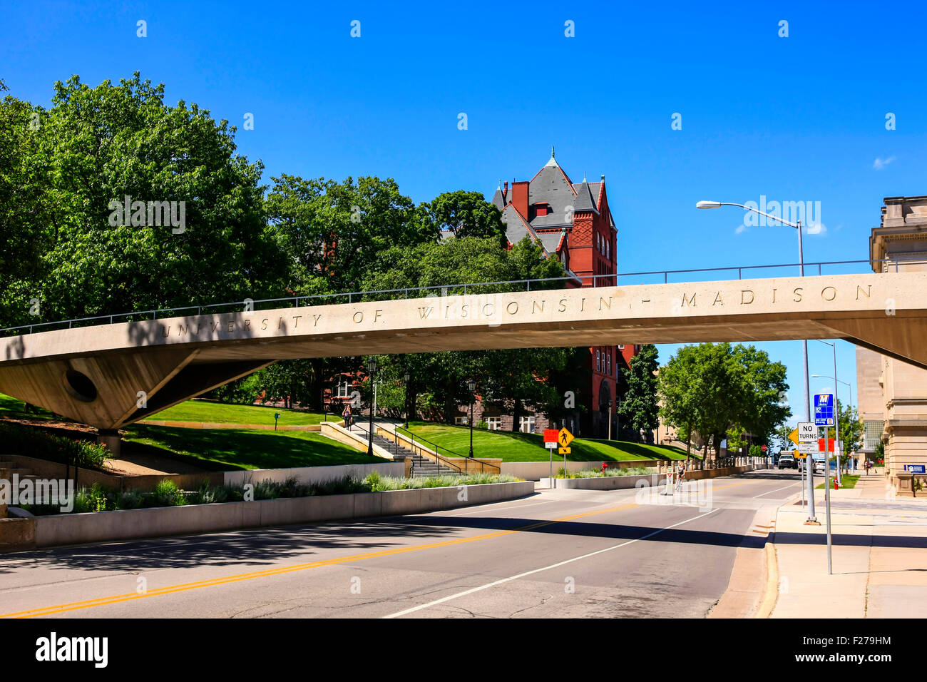 Pedestrian bridge and welcome at the campus entrance of the University ...