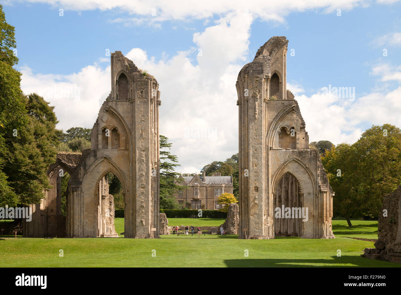Tourists at the ruins of the medieval 13th century Glastonbury Abbey ...