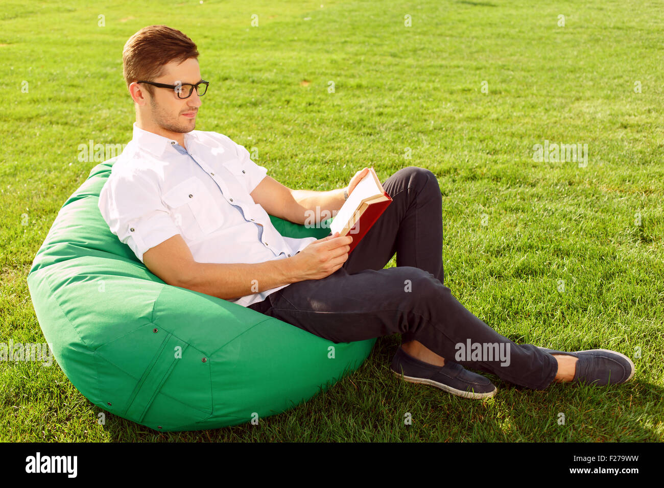 Pleasant guy relaxing Stock Photo - Alamy