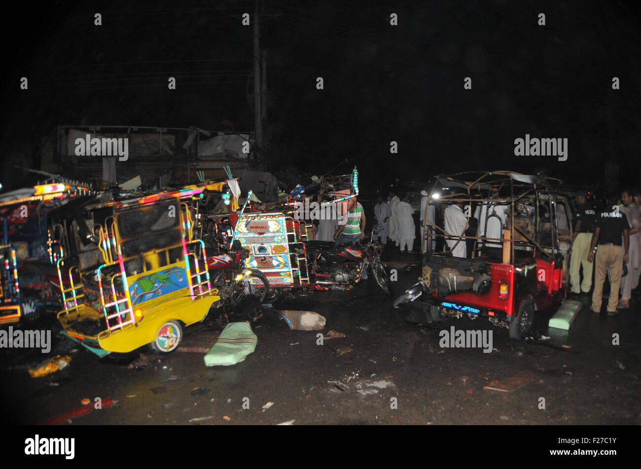 Multan. 13th Sep, 2015. Destroyed vehicles are seen at the blast site ...