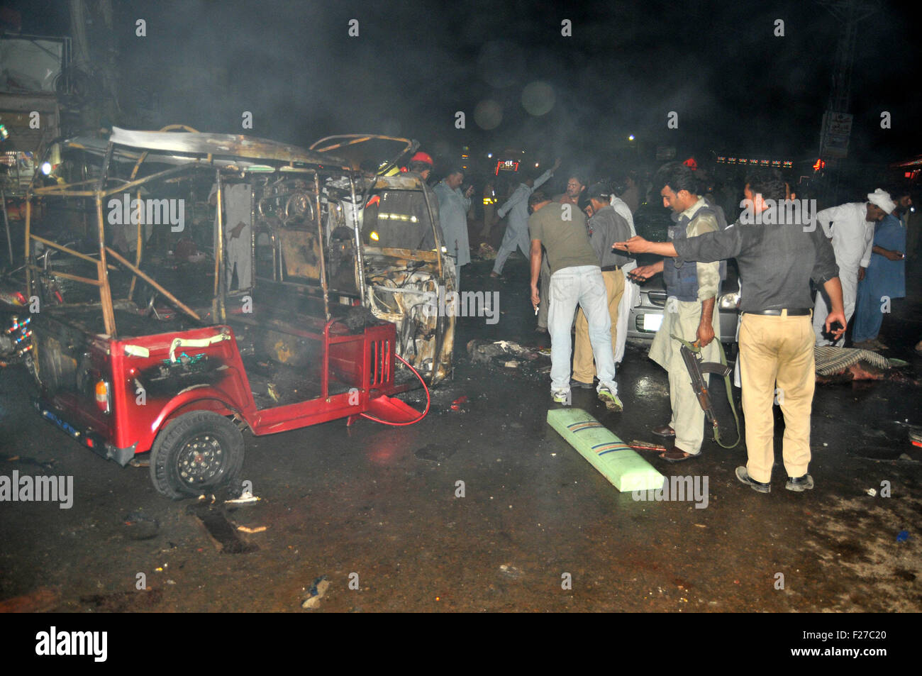 Multan. 13th Sep, 2015. People work at the blast site in Pakistan's ...