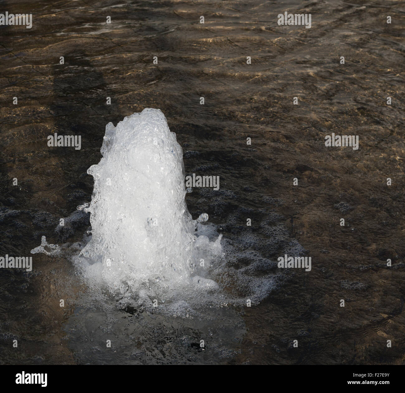 Small geyser in sea Stock Photo - Alamy