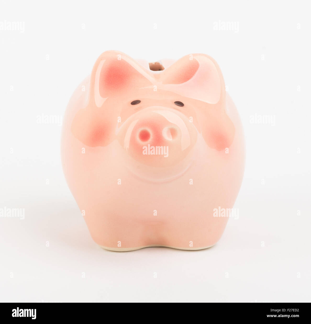 Small piggy bank on white, front view Stock Photo - Alamy