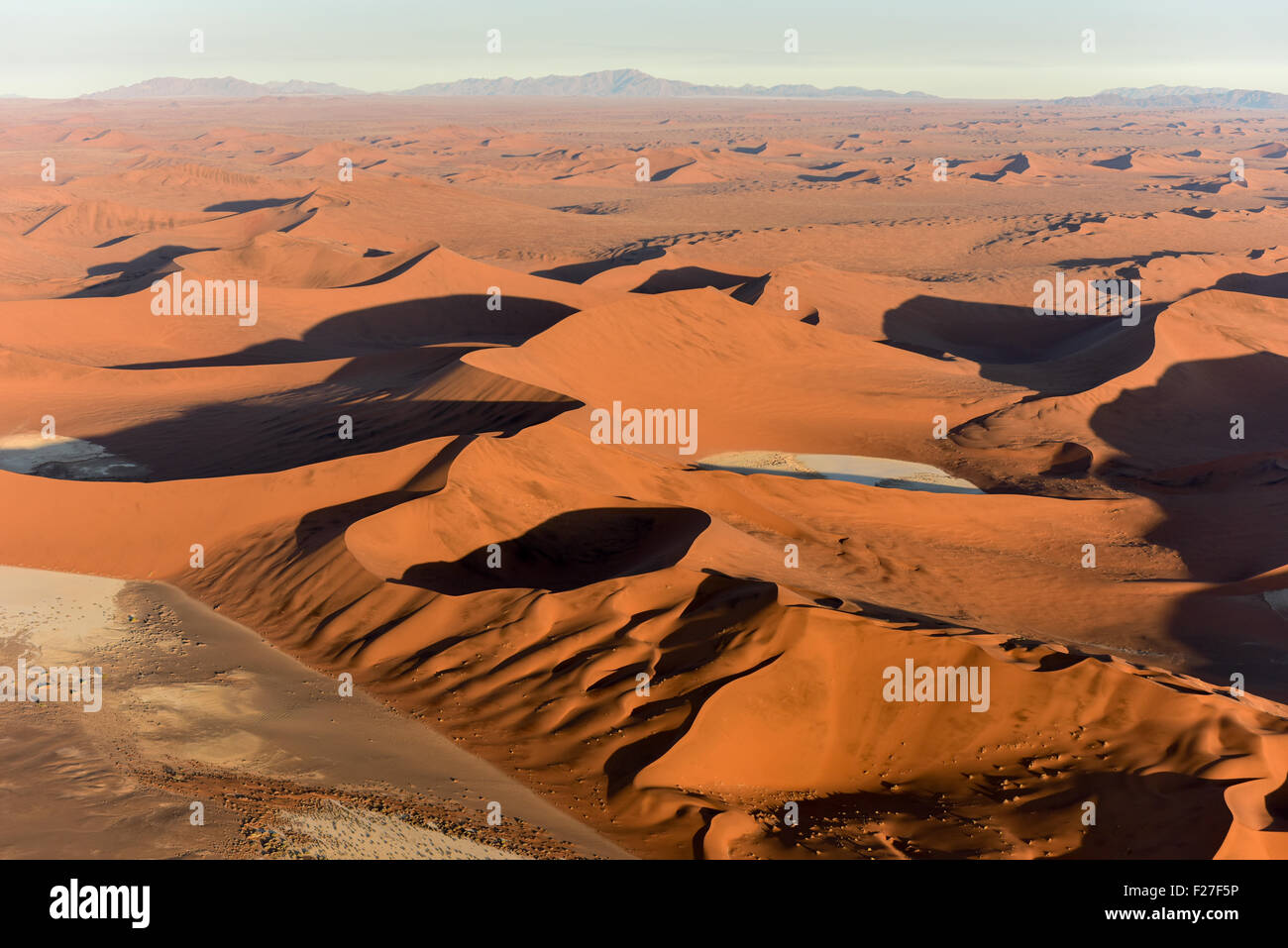 Aerial view of high red dunes, located in the Namib Desert, in the Namib-Naukluft National Park ...