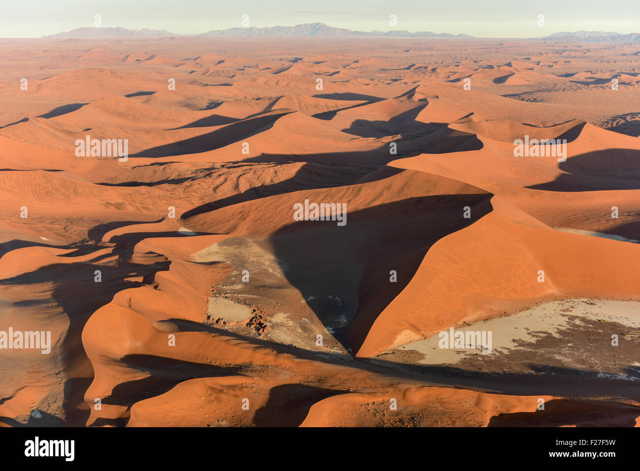 Aerial view of high red dunes, located in the Namib Desert, in the Namib-Naukluft National Park ...