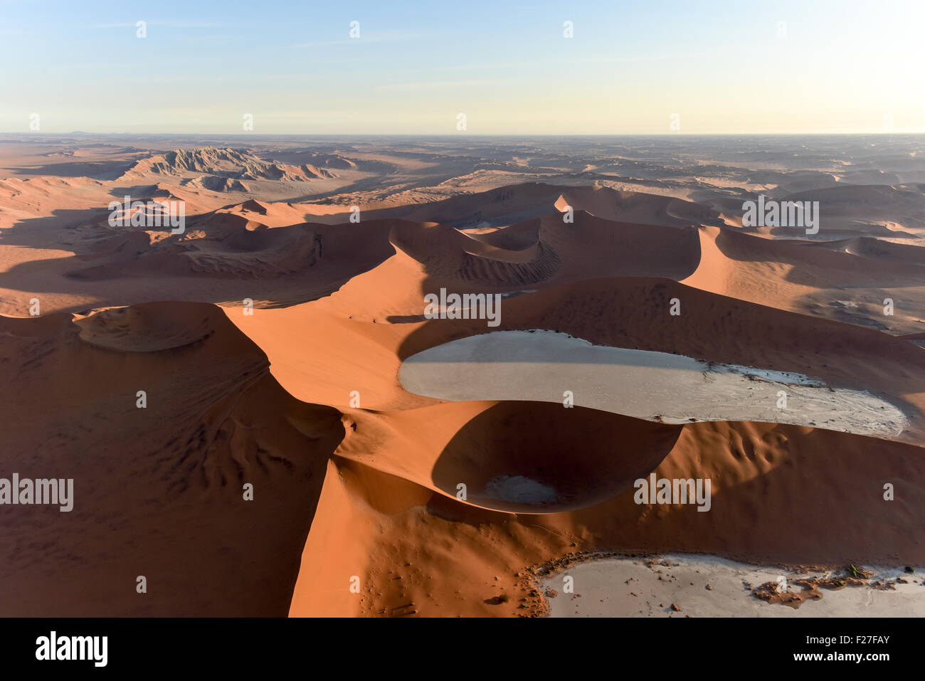 Aerial view of high red dunes, located in the Namib Desert, in the Namib-Naukluft National Park ...