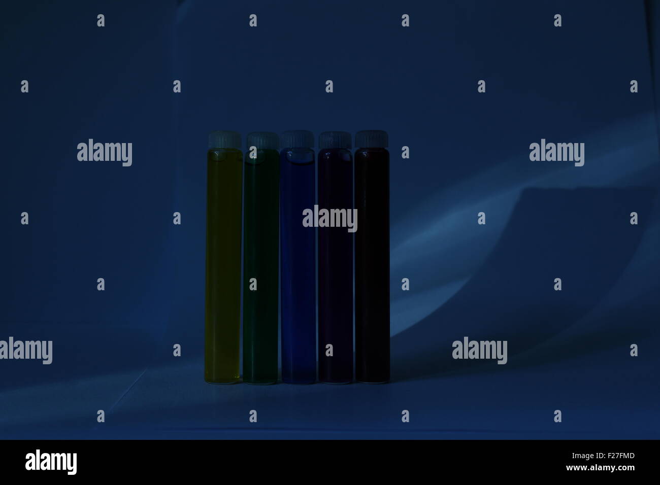 Vials, shadows and the dark Stock Photo - Alamy