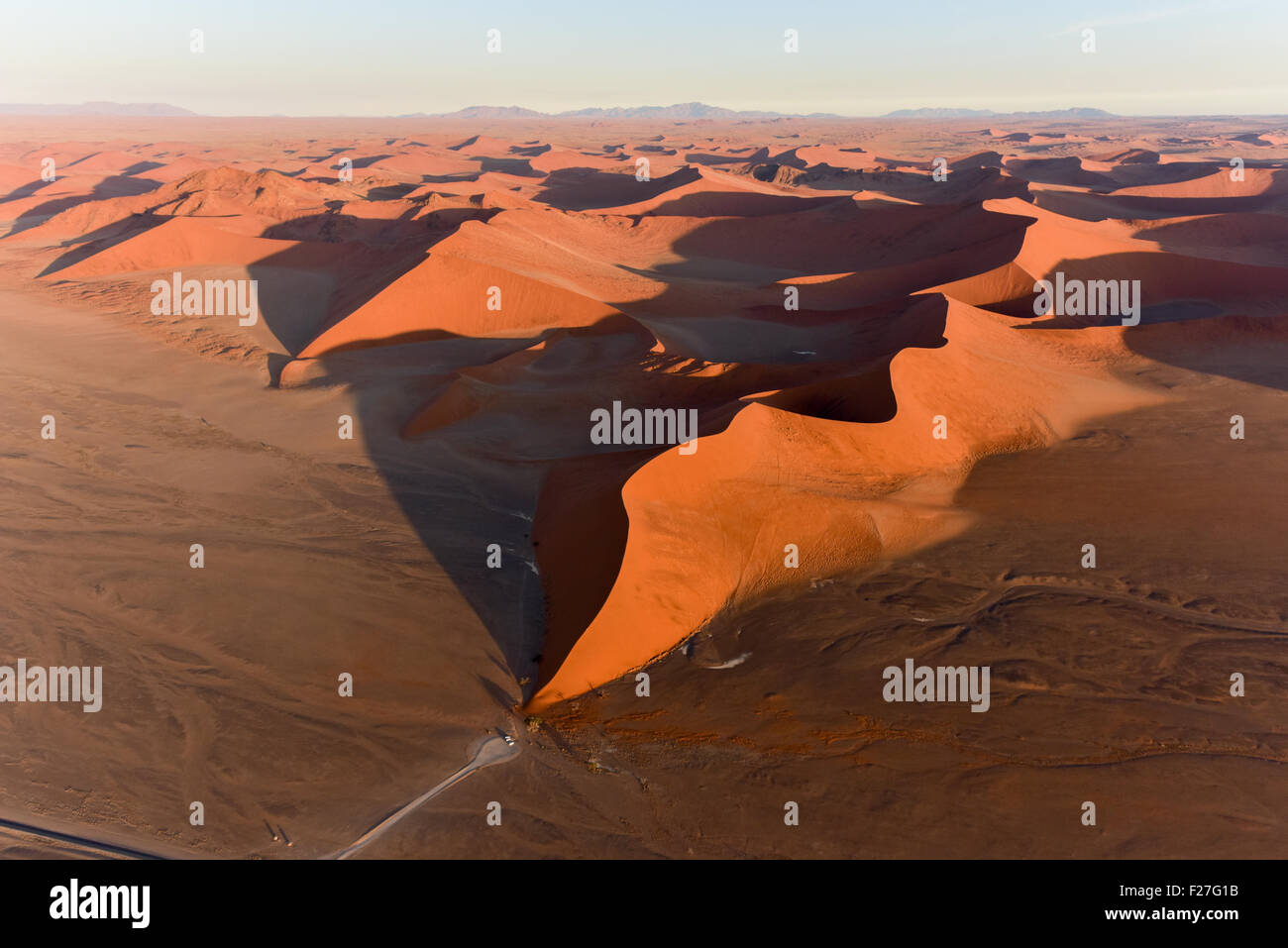 Aerial view of high red dunes, located in the Namib Desert, in the Namib-Naukluft National Park ...