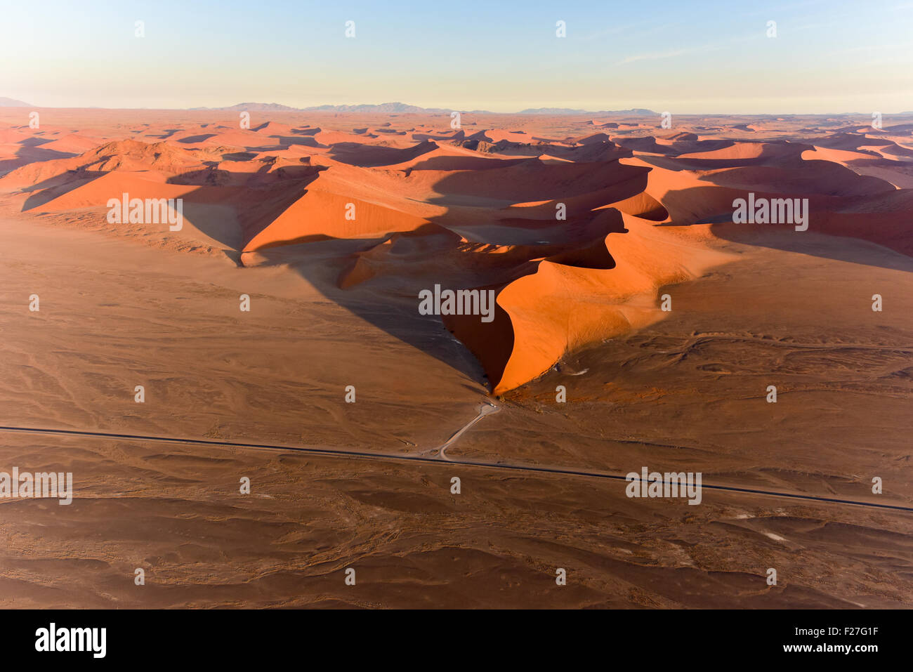 Aerial view of high red dunes, located in the Namib Desert, in the Namib-Naukluft National Park ...