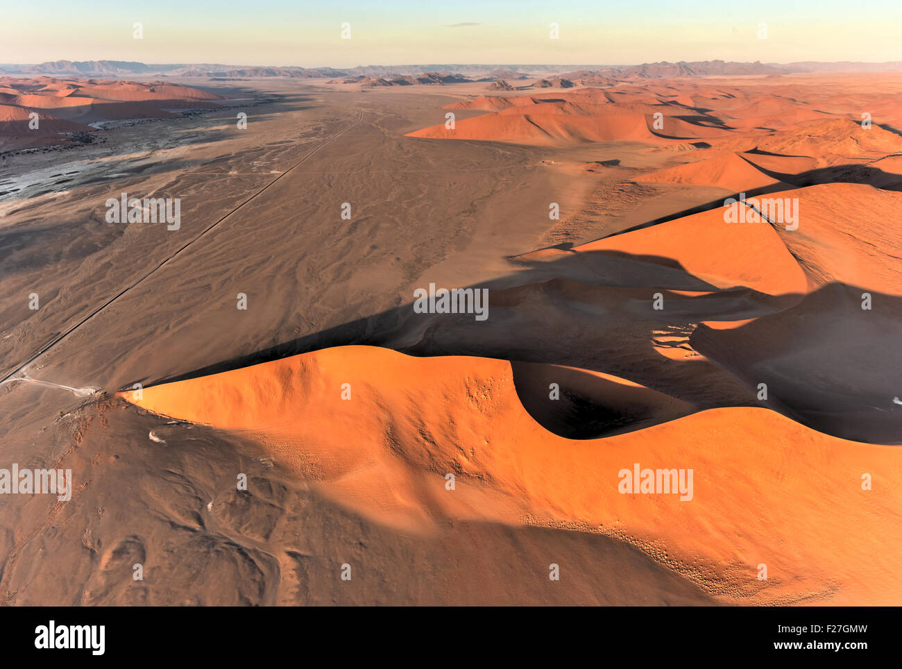 Aerial view of high red dunes, located in the Namib Desert, in the Namib-Naukluft National Park ...