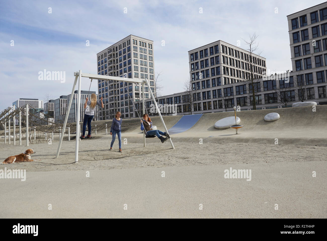 Friends swinging in a playground, Munich, Bavaria, Germany Stock Photo ...