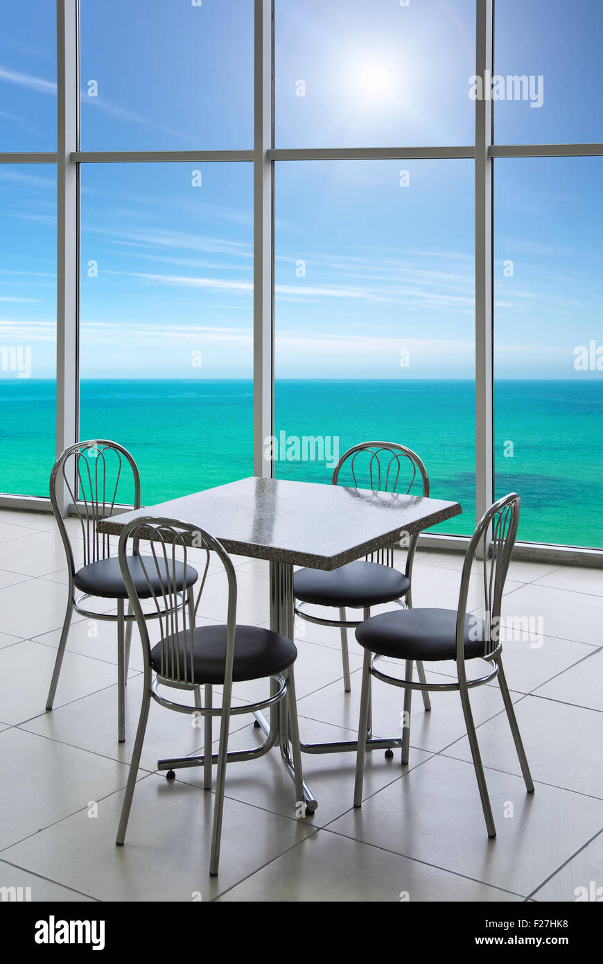Table and chairs on the sea. Nature composition Stock Photo - Alamy