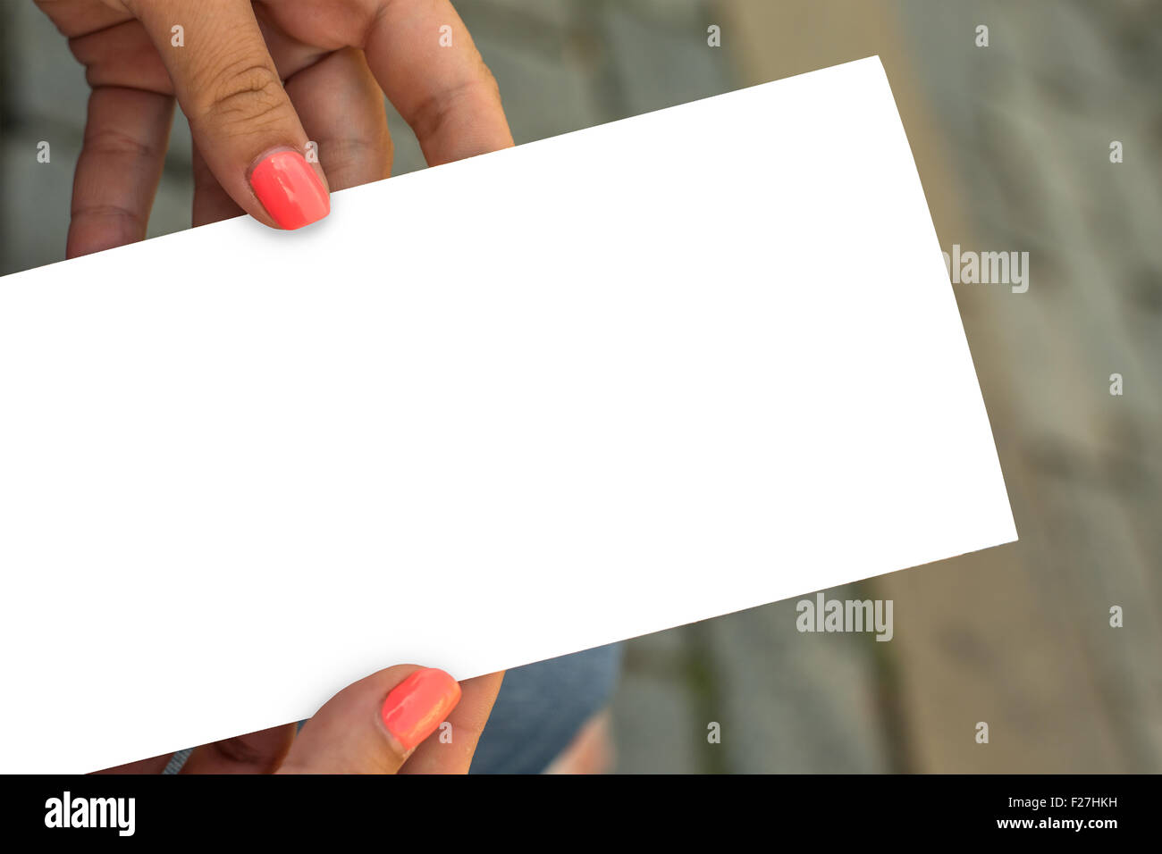Womans hand holding blank piece of paper Stock Photo - Alamy