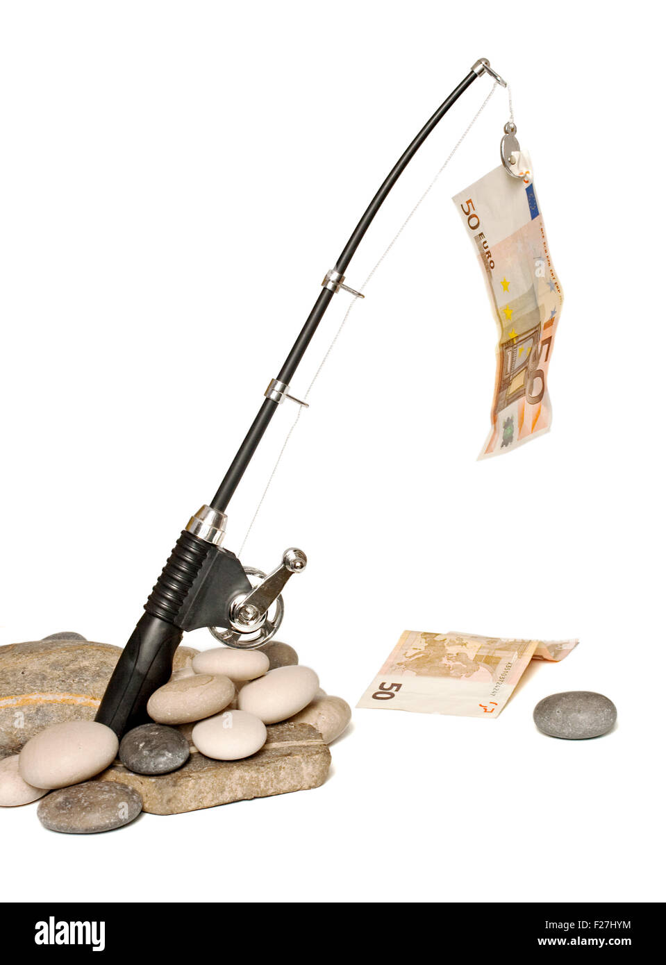 Fishing rod while fishing euro bill on white background Stock Photo - Alamy