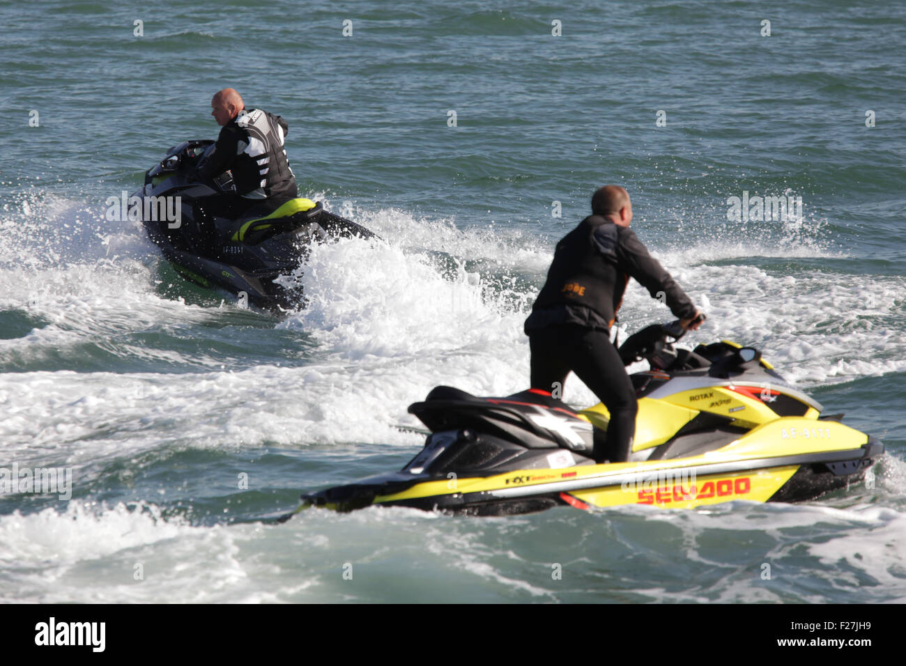 Men on Jet skis in Cowes on the Isle of Wight, UK Stock Photo - Alamy
