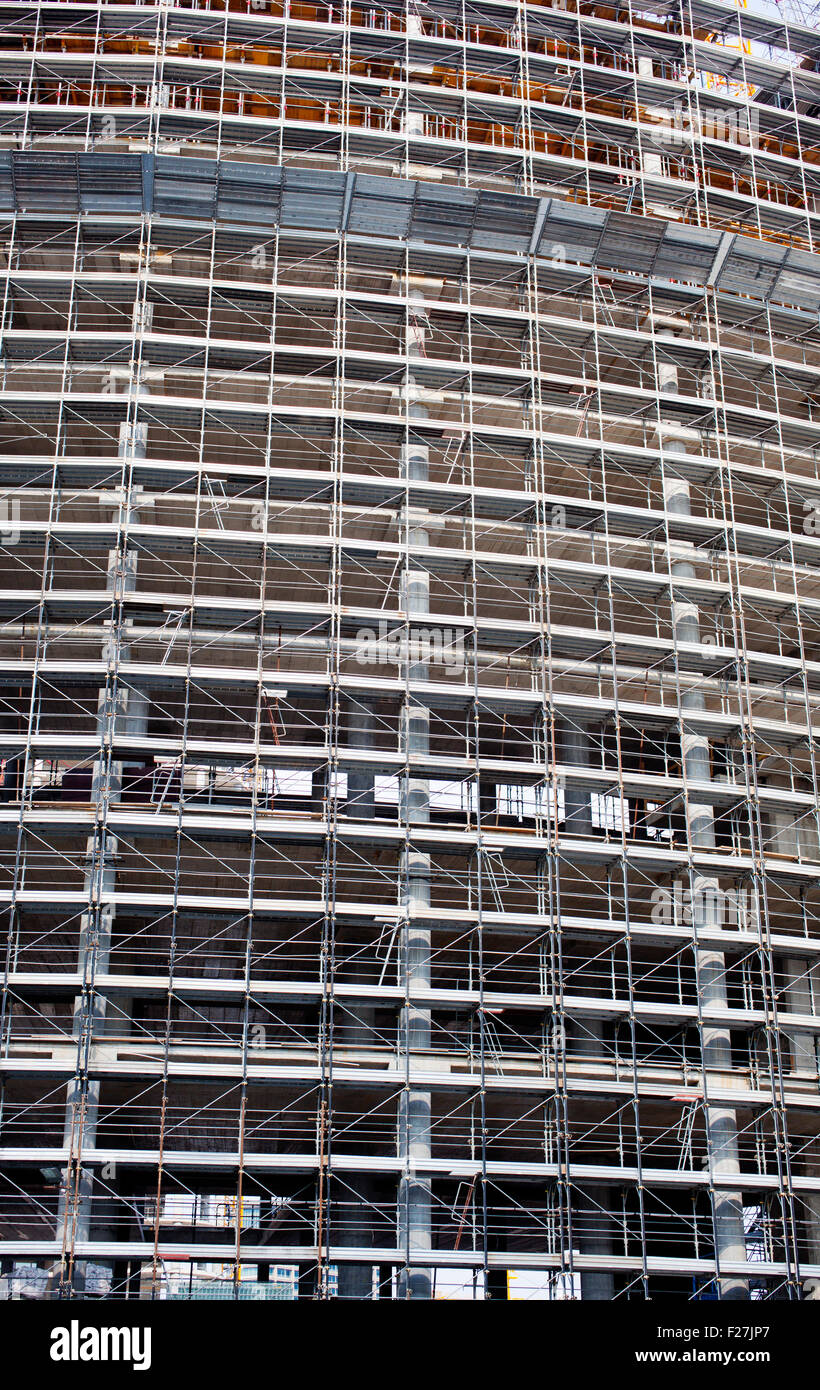 Scaffolding Covering a Building under construction Stock Photo - Alamy
