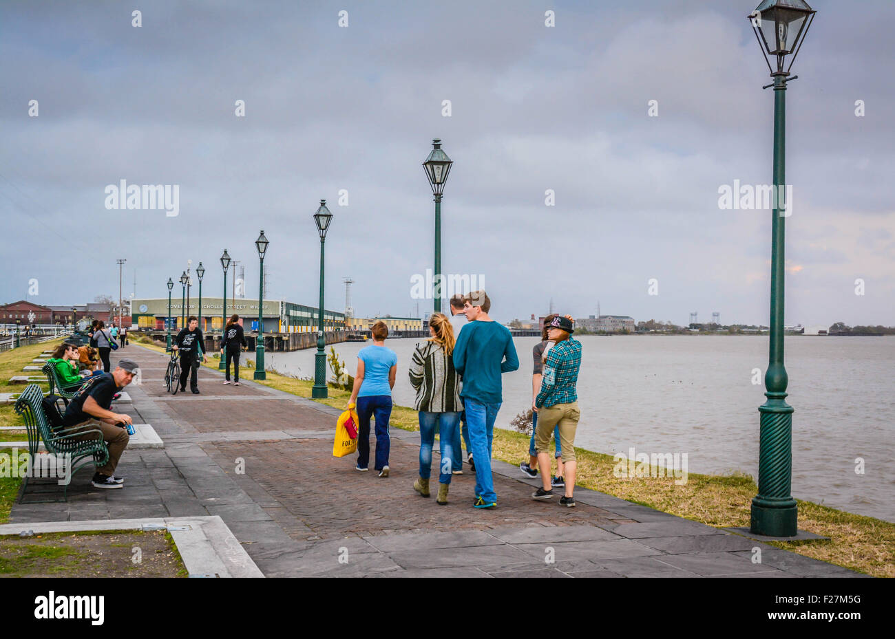 People strolling the riverfront park area overlooking the Mississippi ...