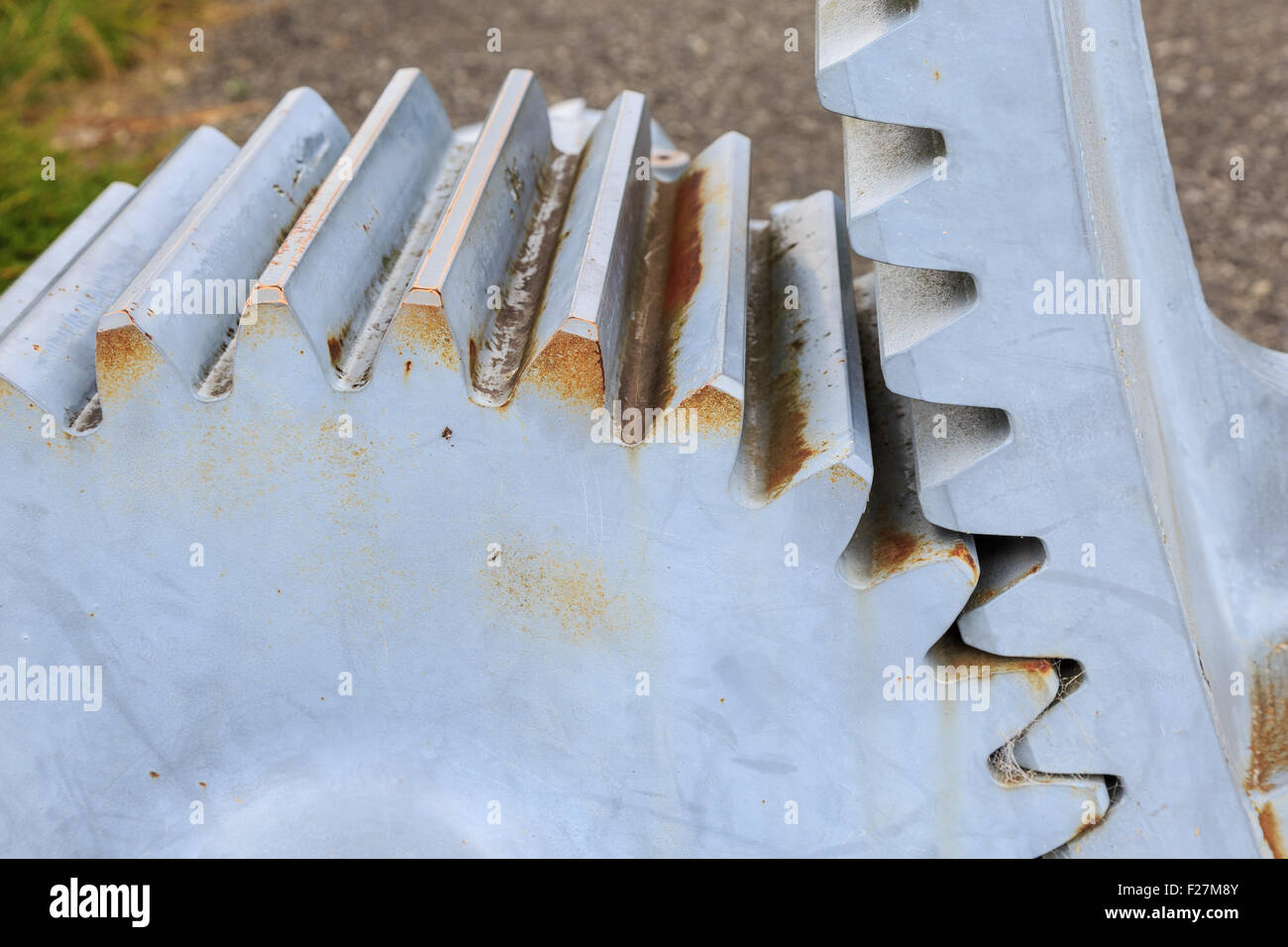 Metal cog wheels interlocked Stock Photo - Alamy