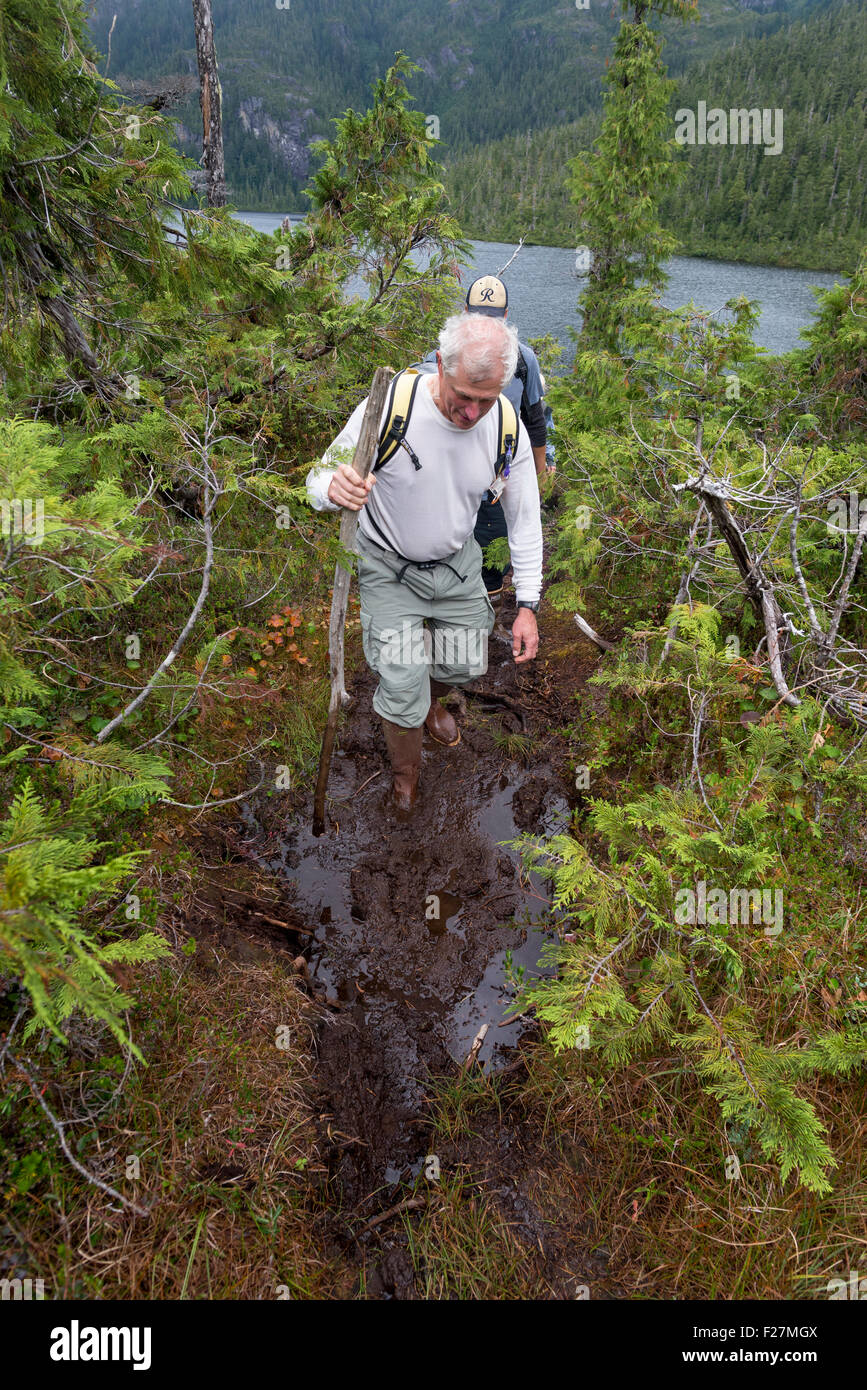 Hiking on a wet and muddy Sadie Lake Trail on Baranof Island, Alaska ...