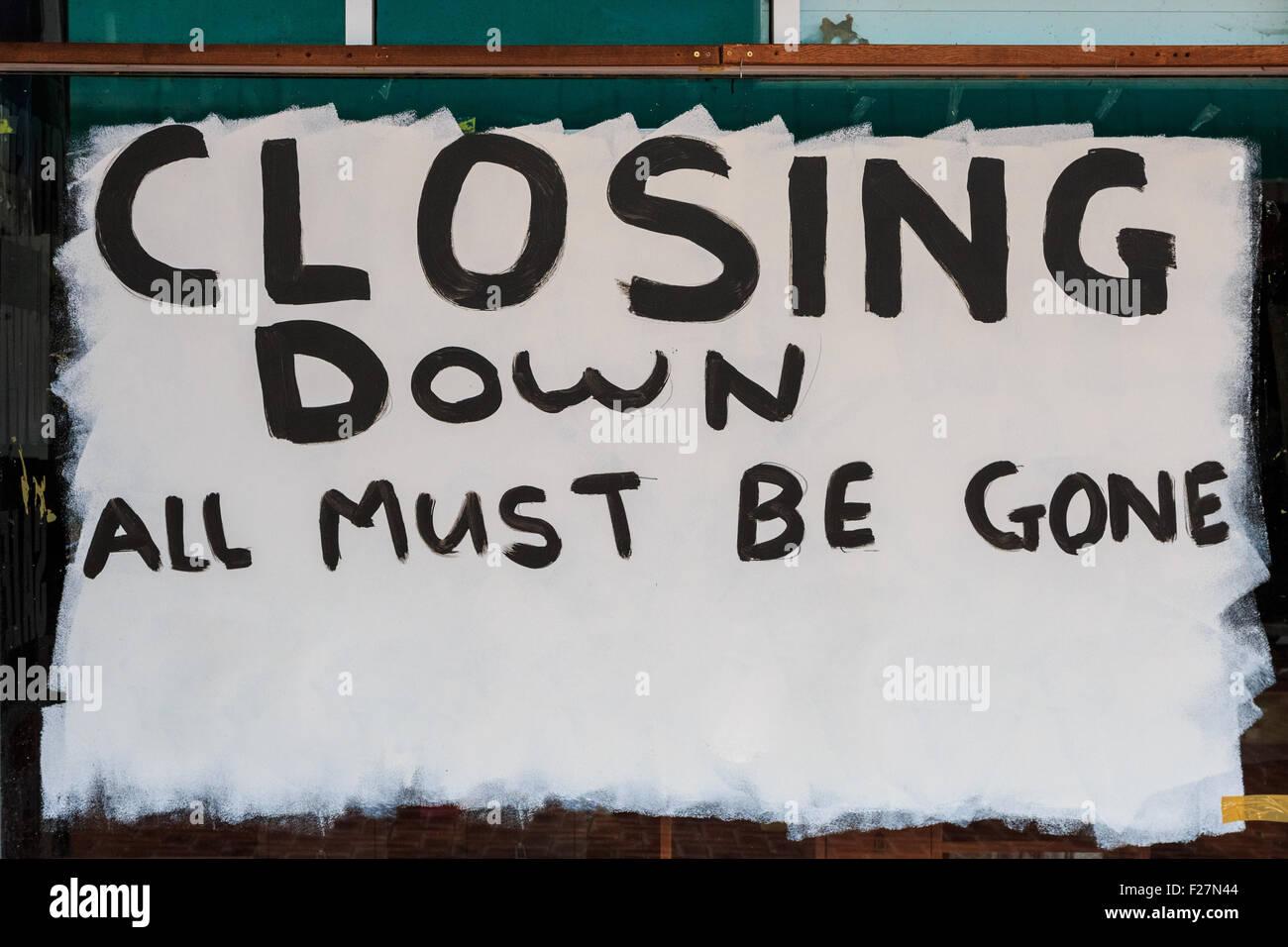 A window display informing of closing down - all must be gone Stock ...
